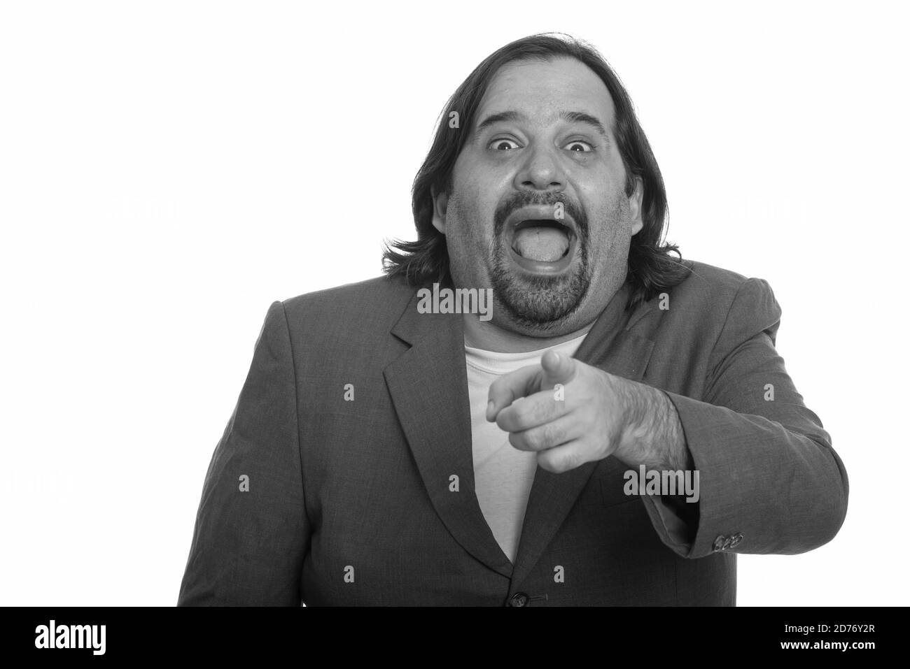 Happy fat Caucasian businessman smiling while laughing and pointing ...
