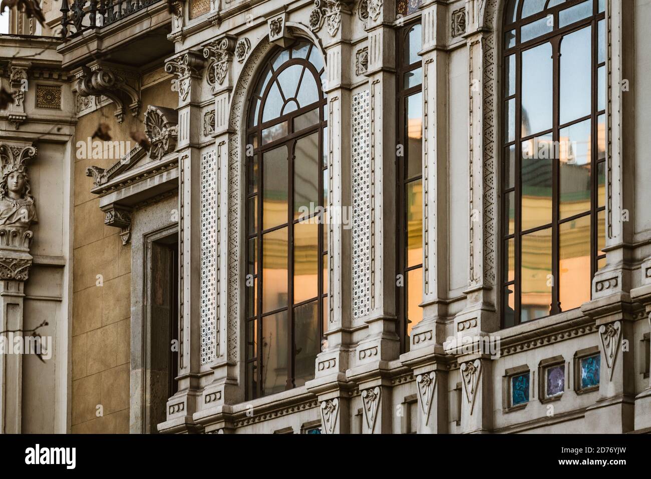 Lattice windows of an ornamental facade of a neoclassical building ...