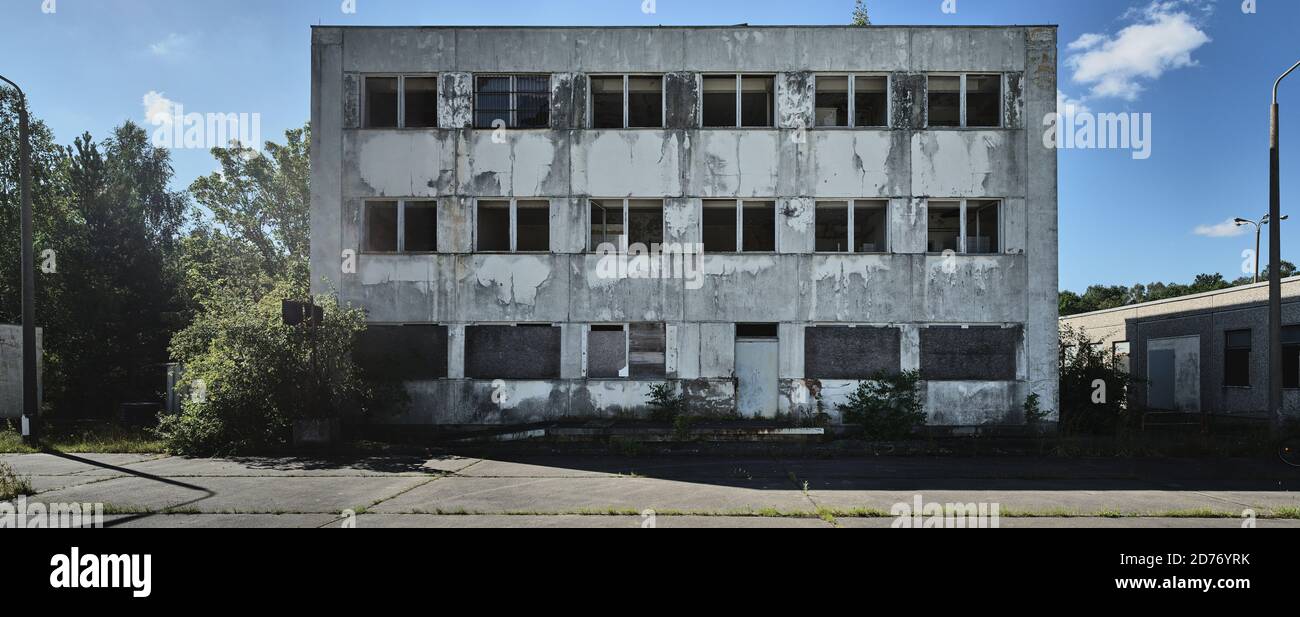 Abandoned office building with windows without glass panes, left to ...