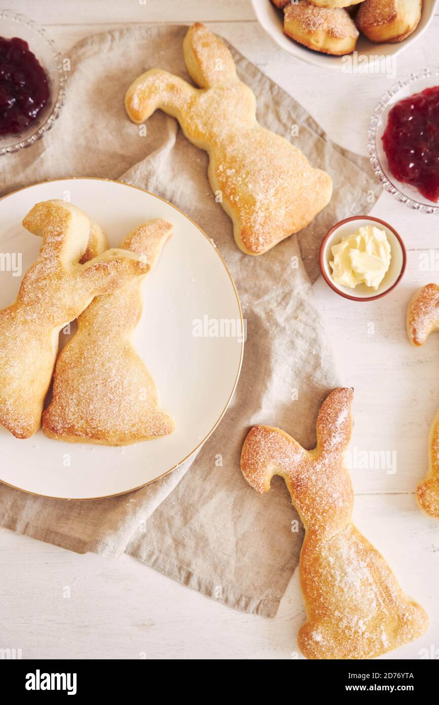 Top view of delicious Easter bunny biscuits on a white table with jelly ...