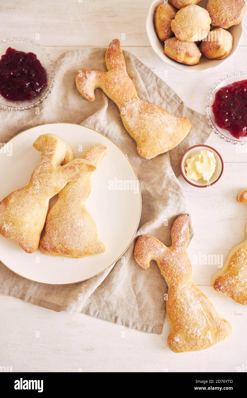 Top view of delicious Easter bunny biscuits on a white table with jelly ...