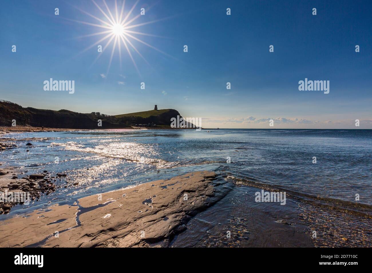 A seam of fossil rich mudstone and shale extending into the sea at ...