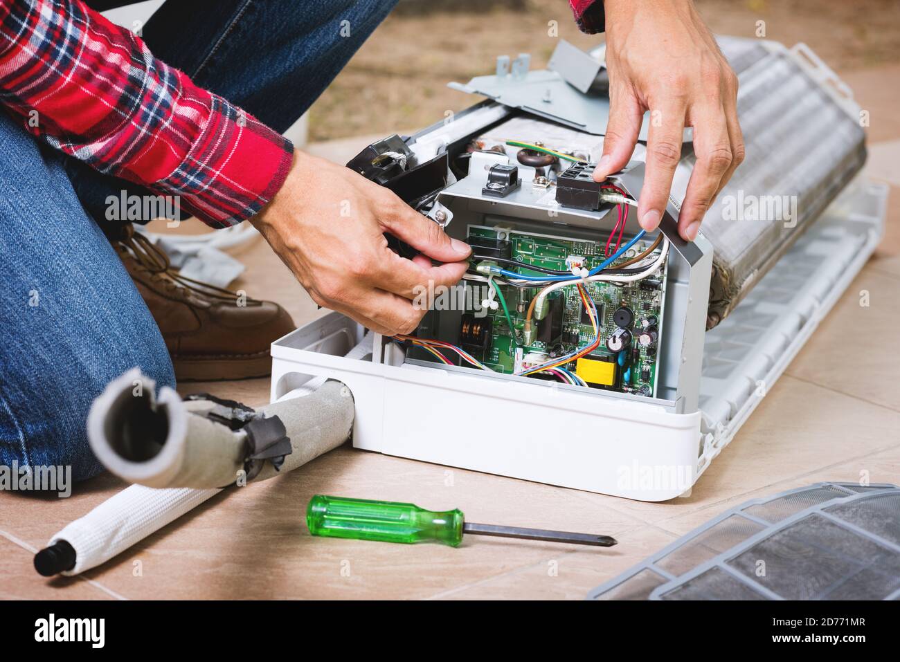 Air conditioning service, repair & maintenance concept. closeup at an ...