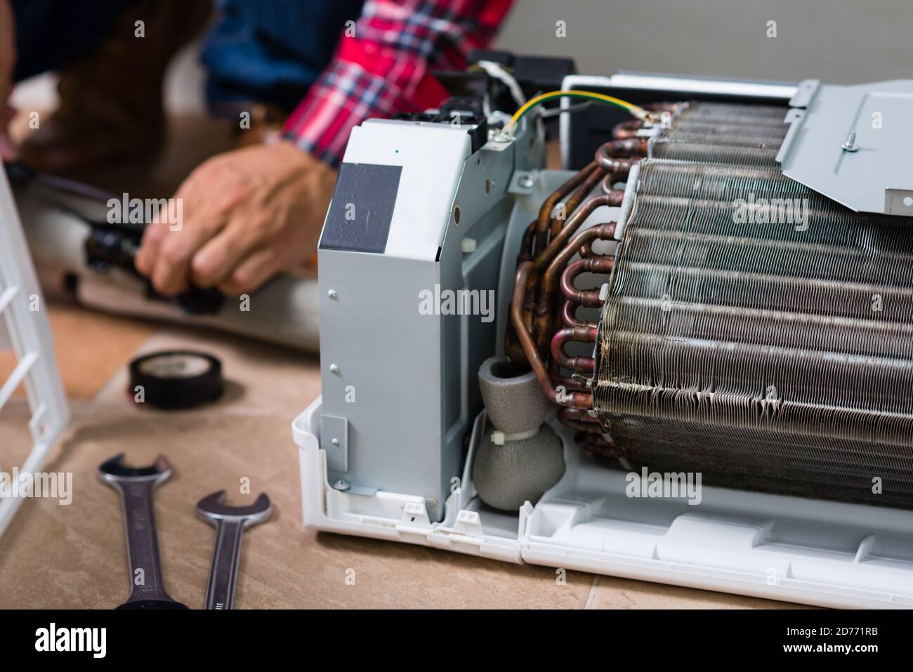 Air conditioning service, repair & maintenance concept. closeup at an ...