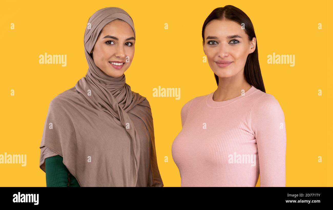 Muslim Women Posing Wearing Hijab And Modern Clothes In Studio Stock ...