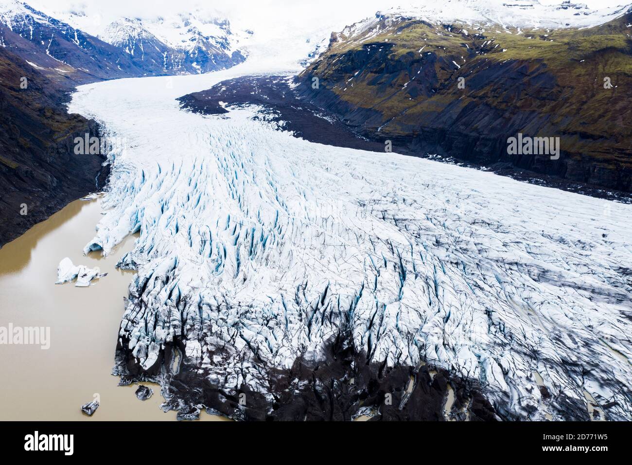 Beautiful glaciers flow through the mountains in Iceland. Aerial view ...