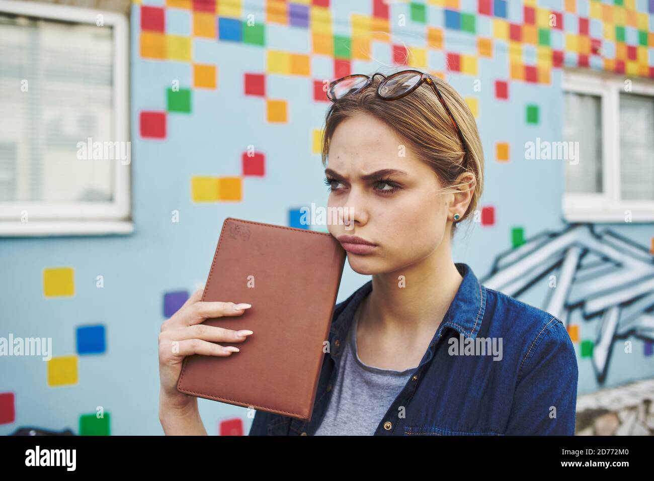 Business woman with notepad in hands outdoors building walk lifestyle ...