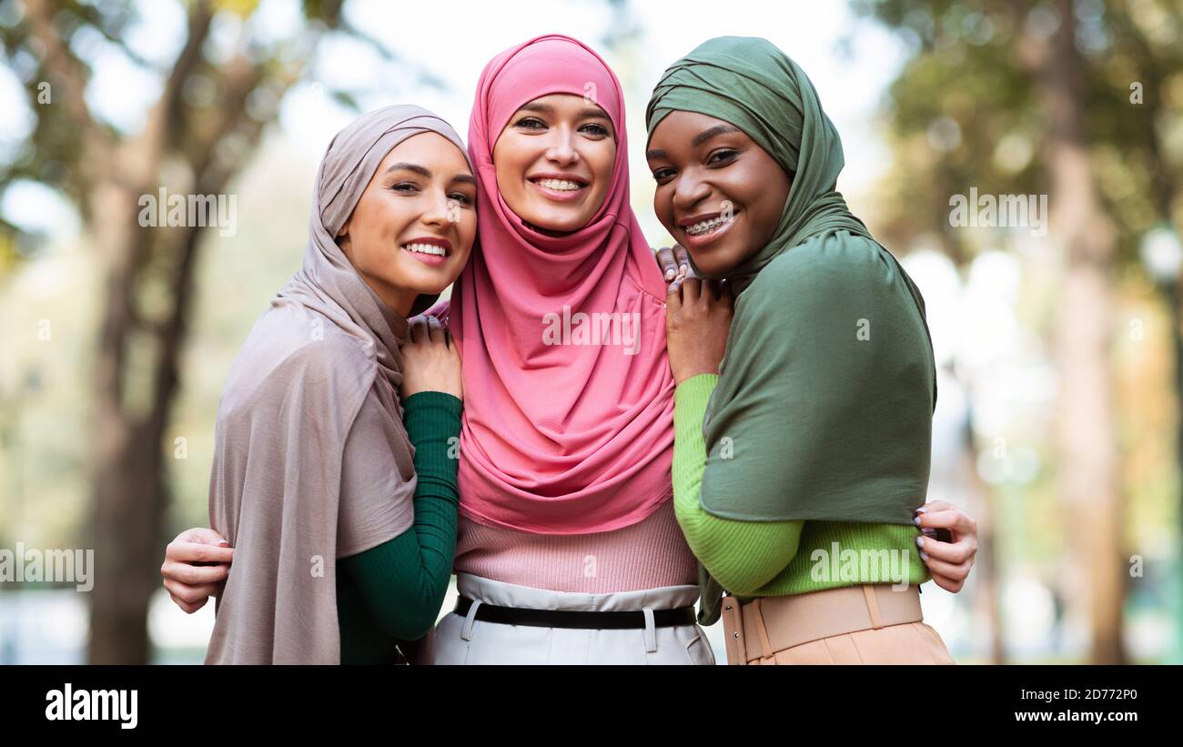 Three Muslim Women In Hijab Posing Hugging Outdoors, Panorama Stock ...