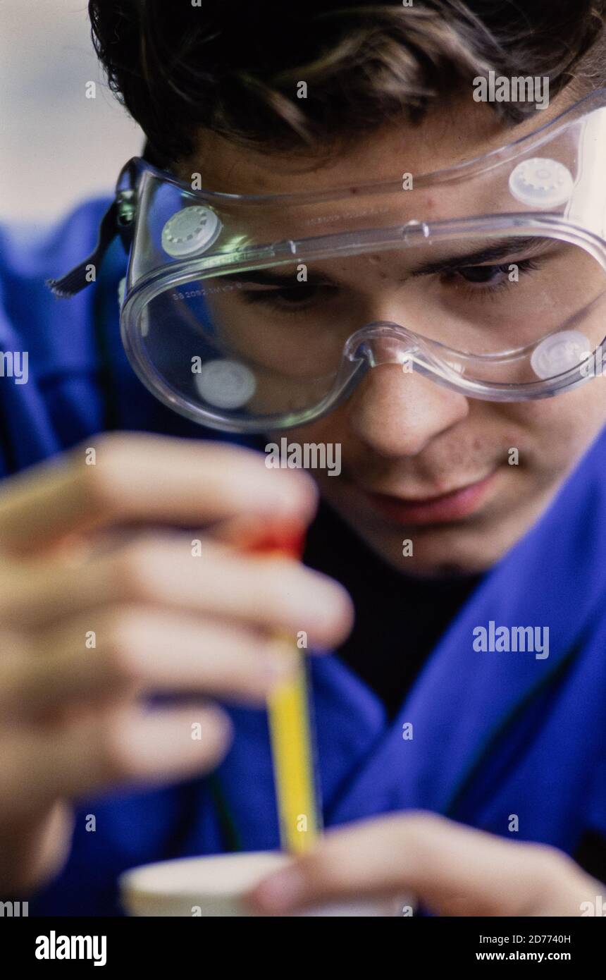 Sixth form student working on a practical science experiment at ...