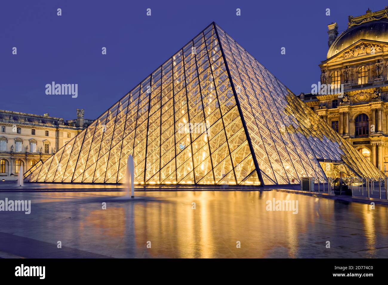 The Louvre pyramide at night Stock Photo - Alamy