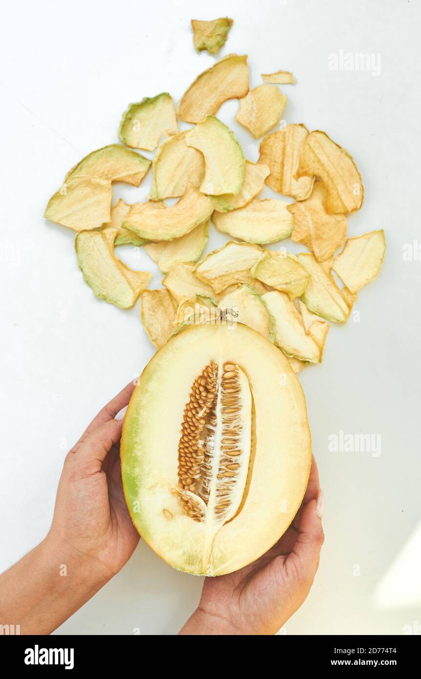 Flat lay composition with fresh and dried melon slices on white ...