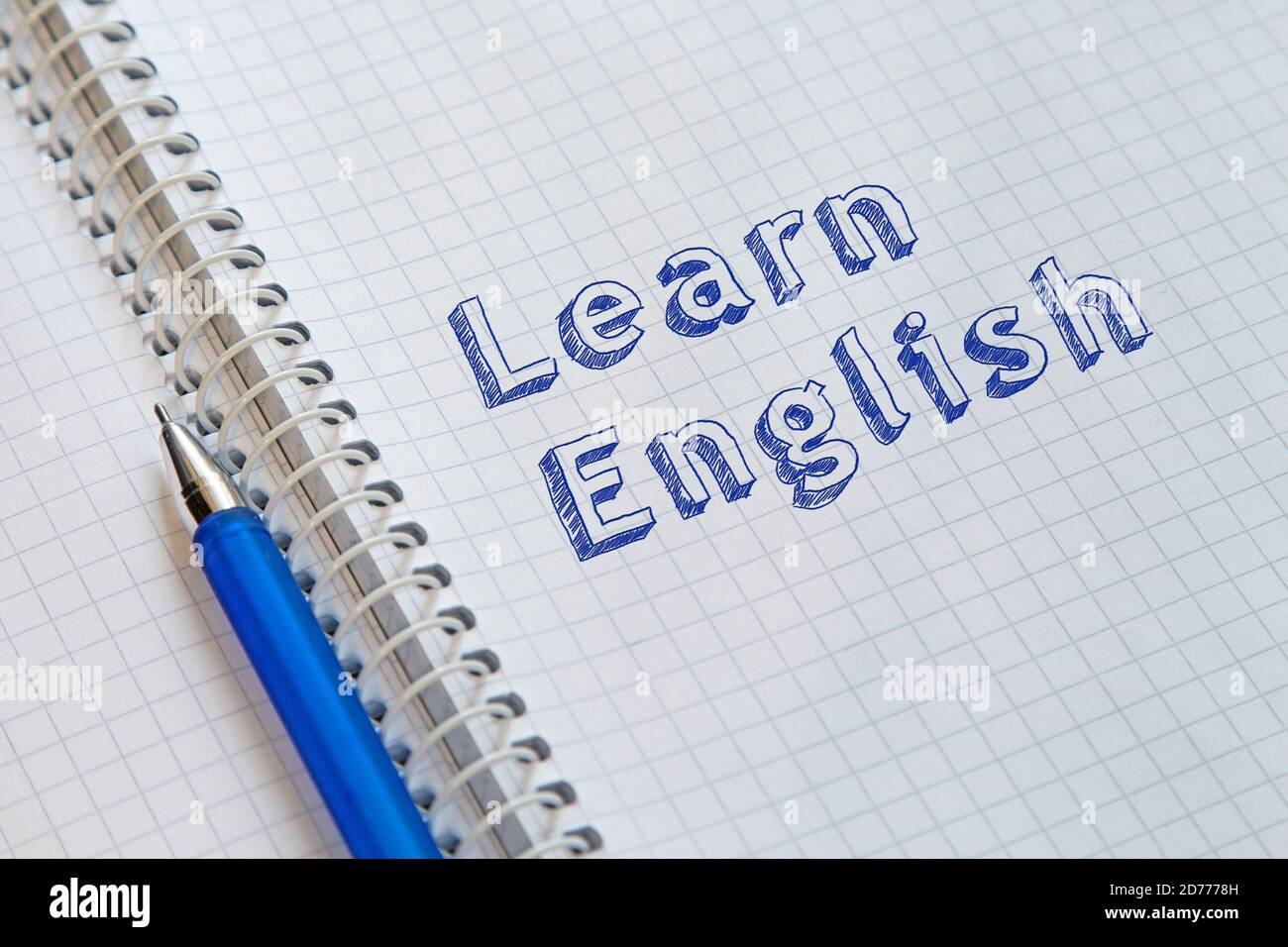 Learn English. Text handwritten on sheet of notebook Stock Photo - Alamy