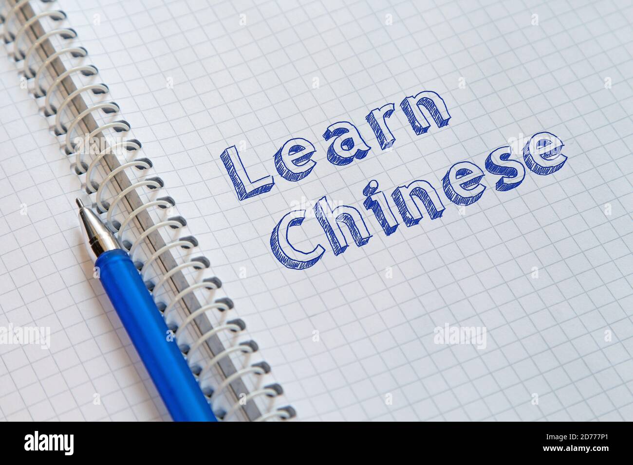 Learn Chinese. Text handwritten on sheet of notebook Stock Photo - Alamy