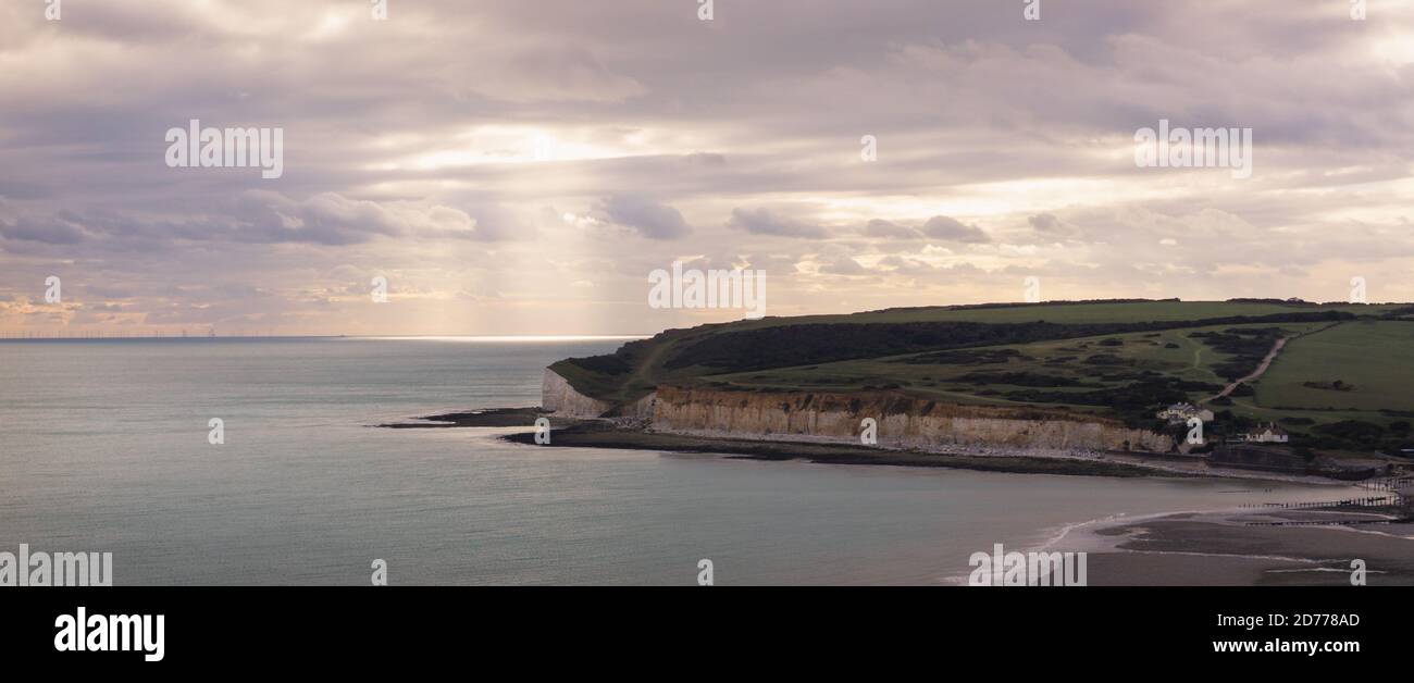 panoramic view of a sunset over the white cliffs dover seven sisters ...