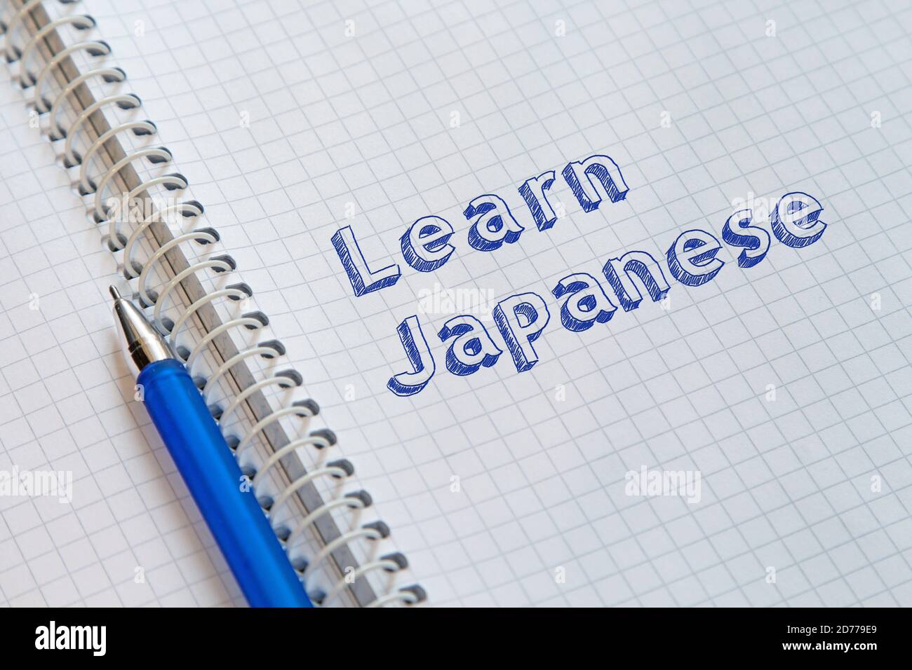 Learn Japanese. Text handwritten on sheet of notebook Stock Photo - Alamy