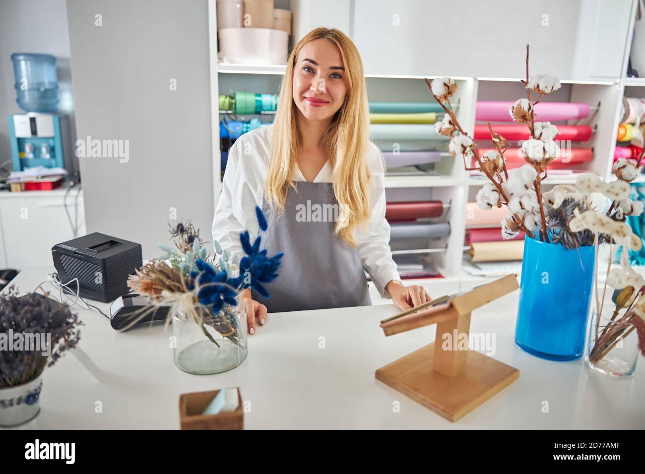 Beautiful female florist posing at her flower studio Stock Photo - Alamy