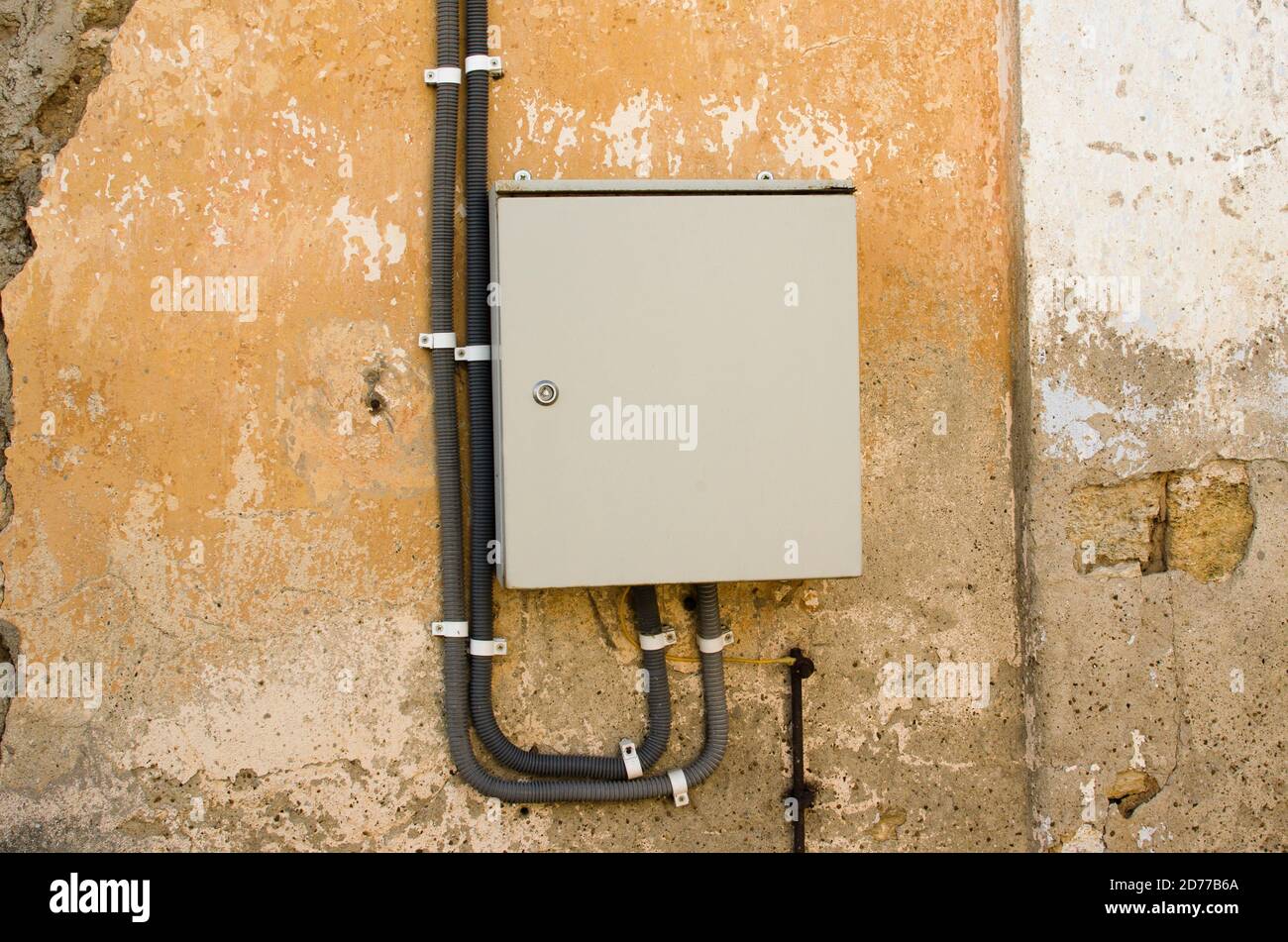 Electric shield on the wall of an old house Stock Photo - Alamy