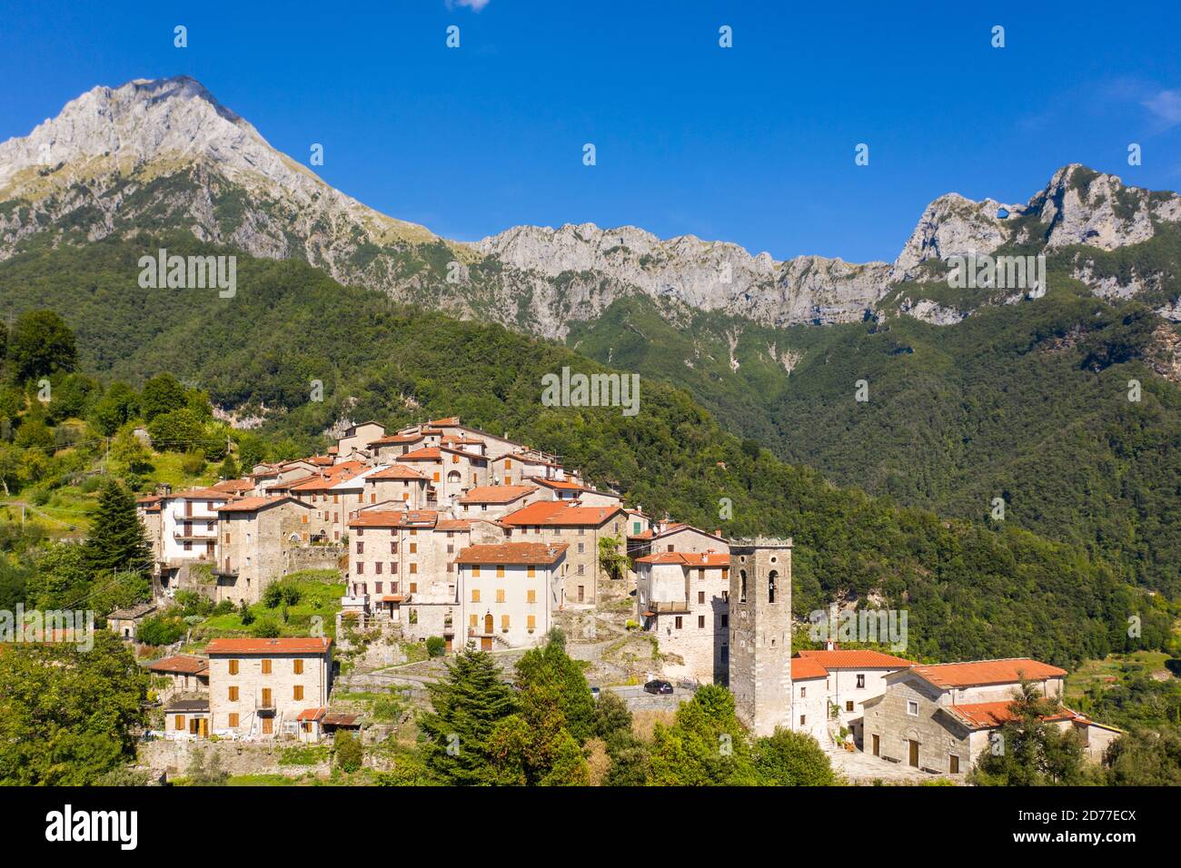 The hilltop village of Pruno with mountains behind, Apuan Alps, Italy ...