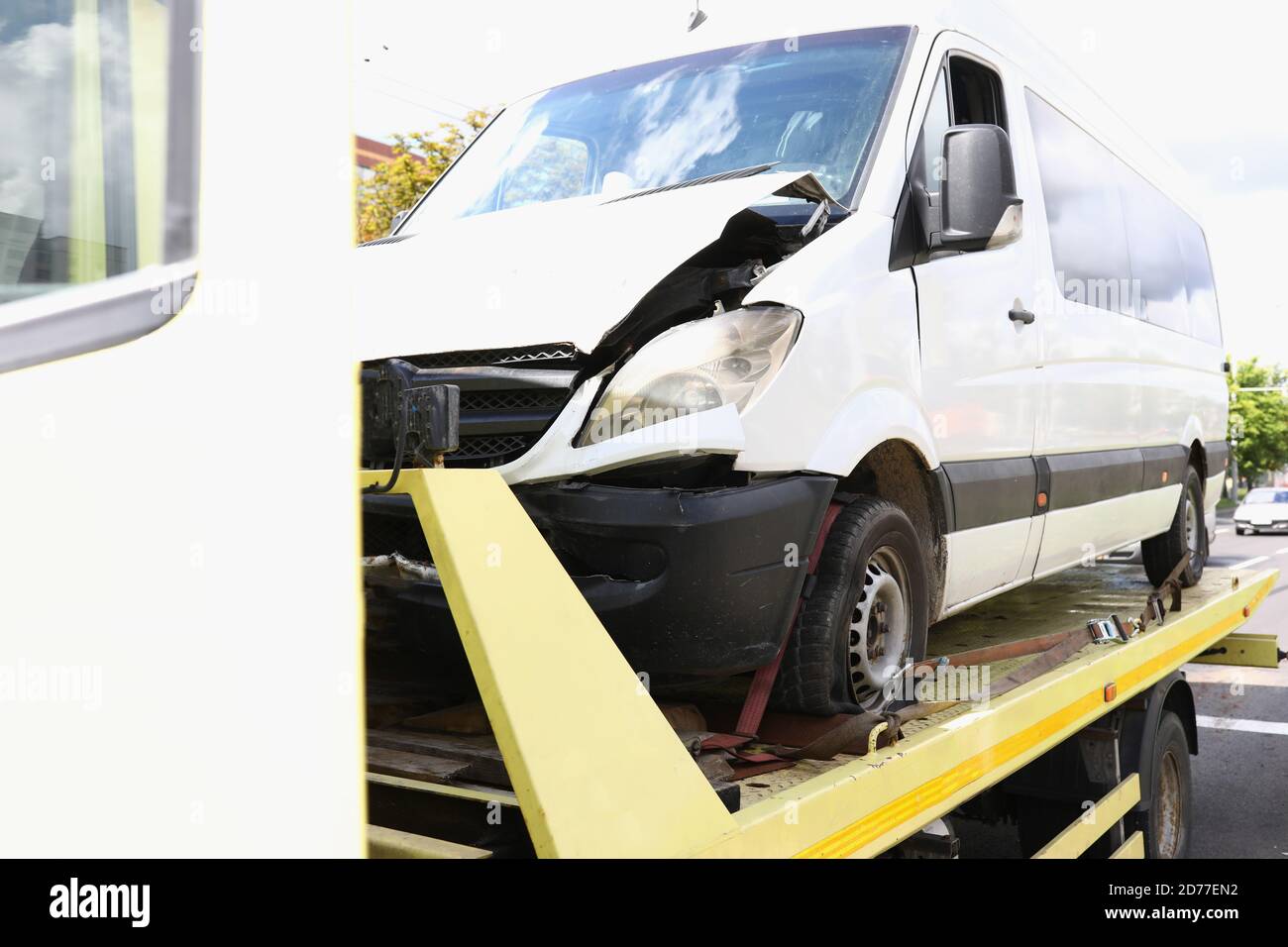 Broken hood of car that stands on tow truck Stock Photo - Alamy