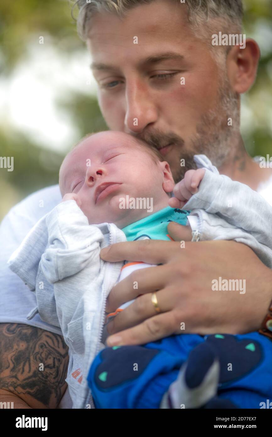 Newborn baby embraced by his father. Family and love concept Stock ...