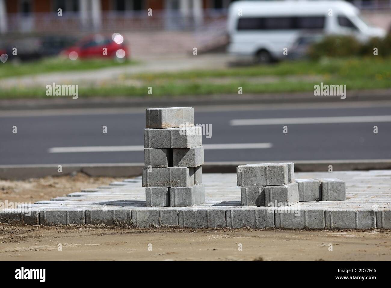Road repair and paving slabs laying closeup Stock Photo - Alamy