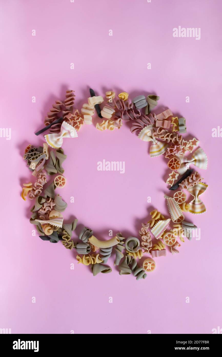 Italian pasta of different shapes and colors in the shape of a circle ...