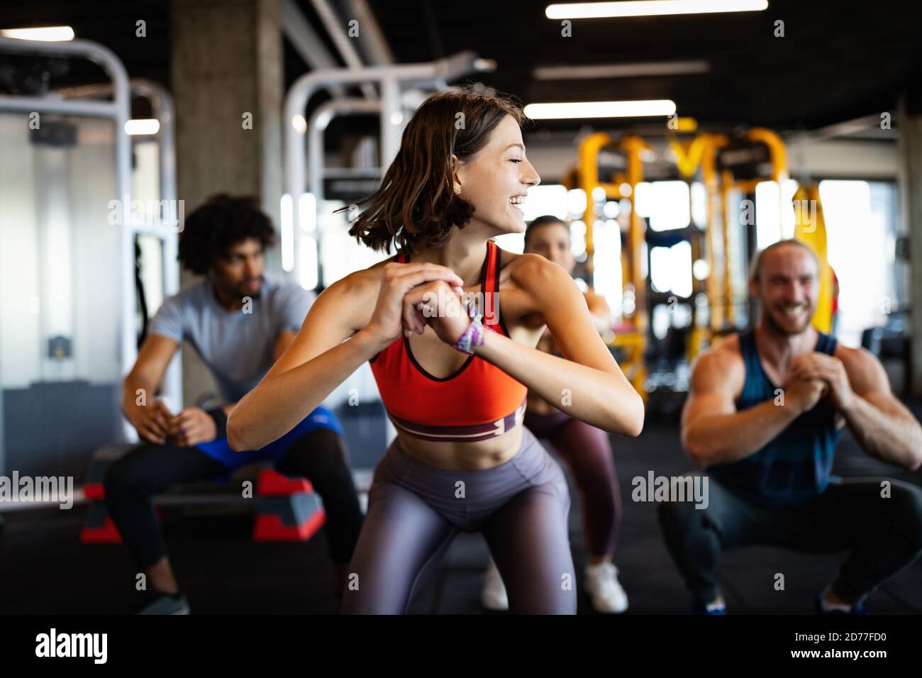 Beautiful fit people working out in gym together Stock Photo - Alamy