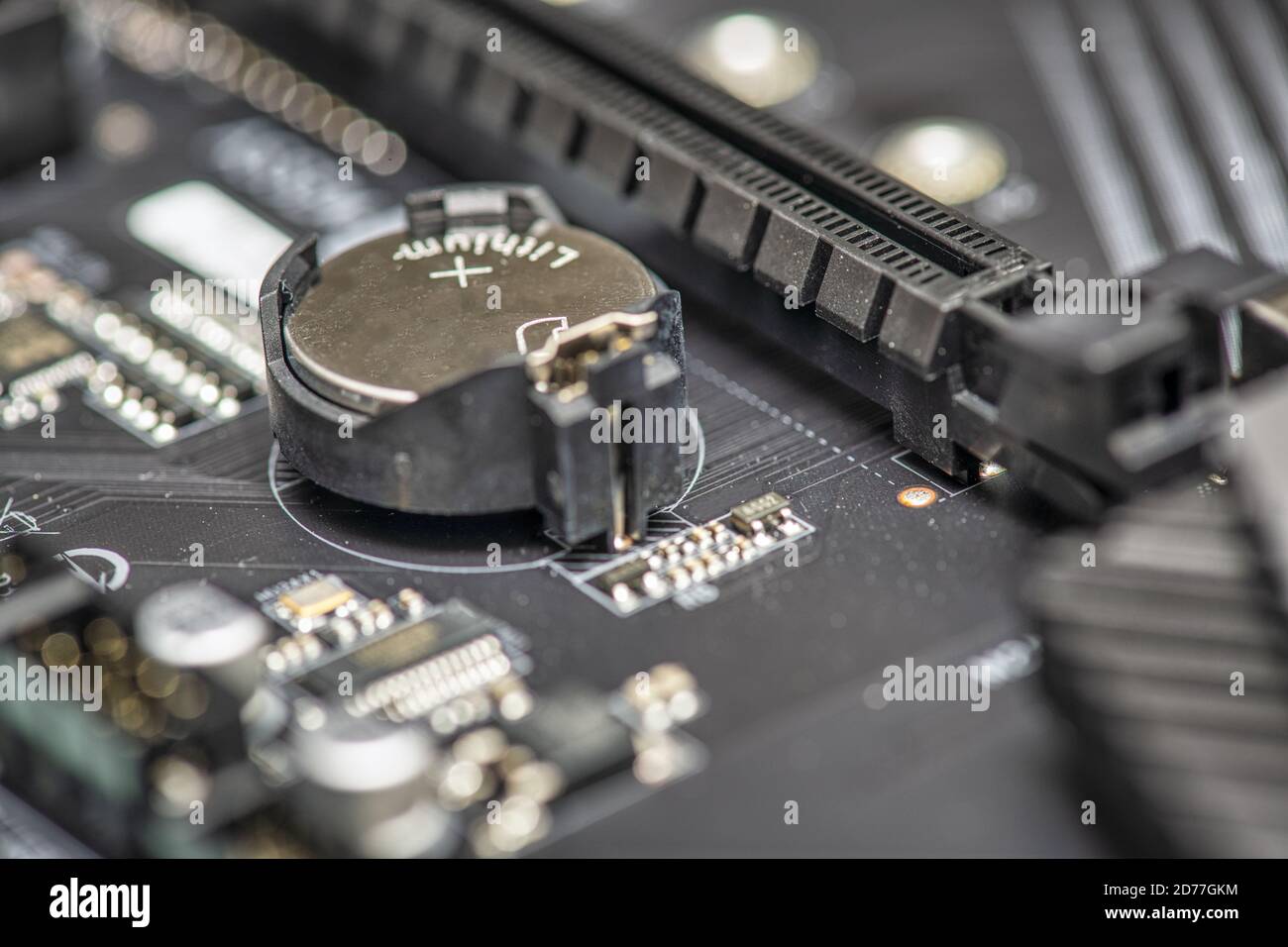 Close up view of a motherboard detail in a pc. Detail on small battery ...