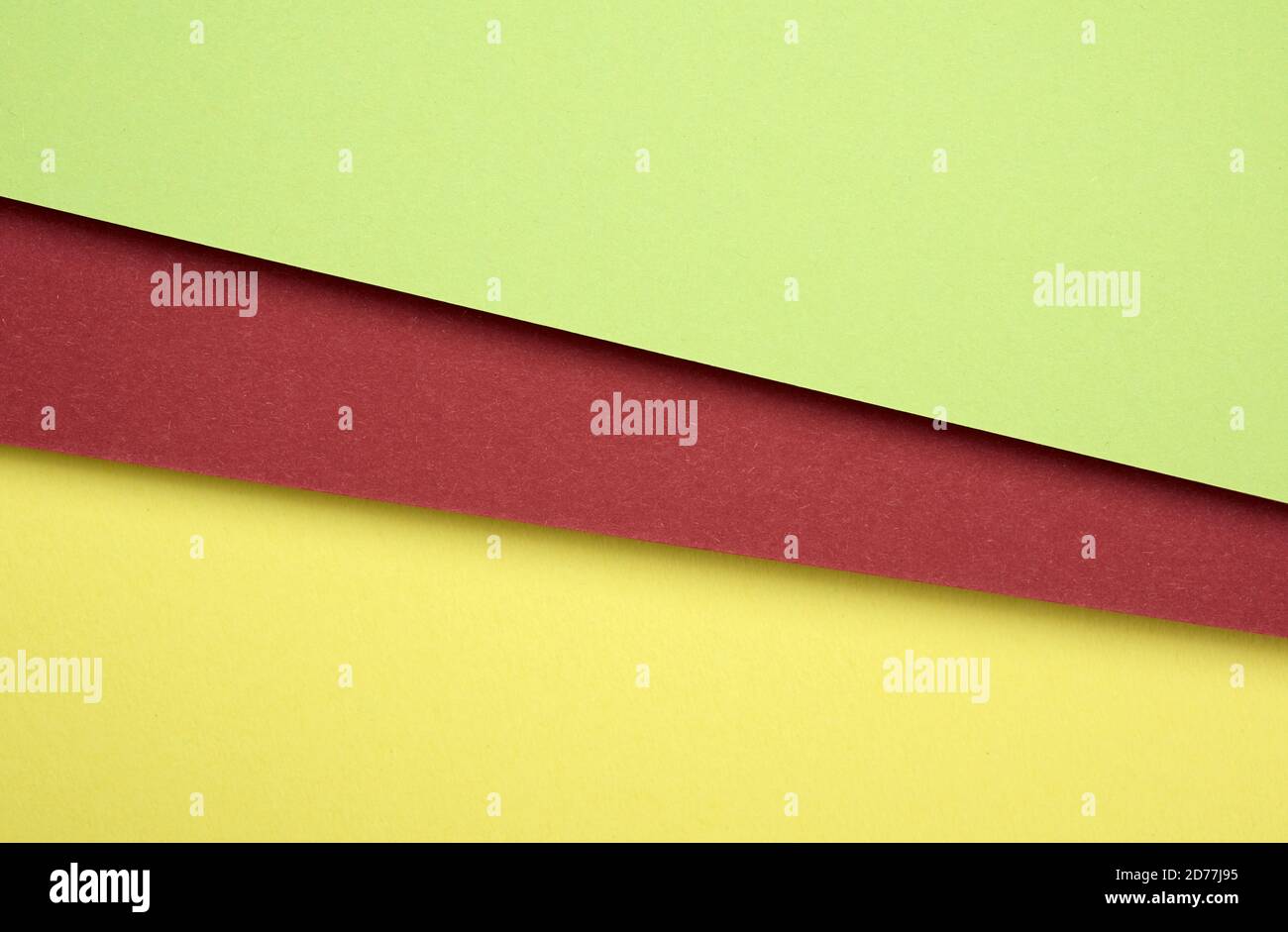 cardboard sheets of colored green, red and yellow paper, abstract ...