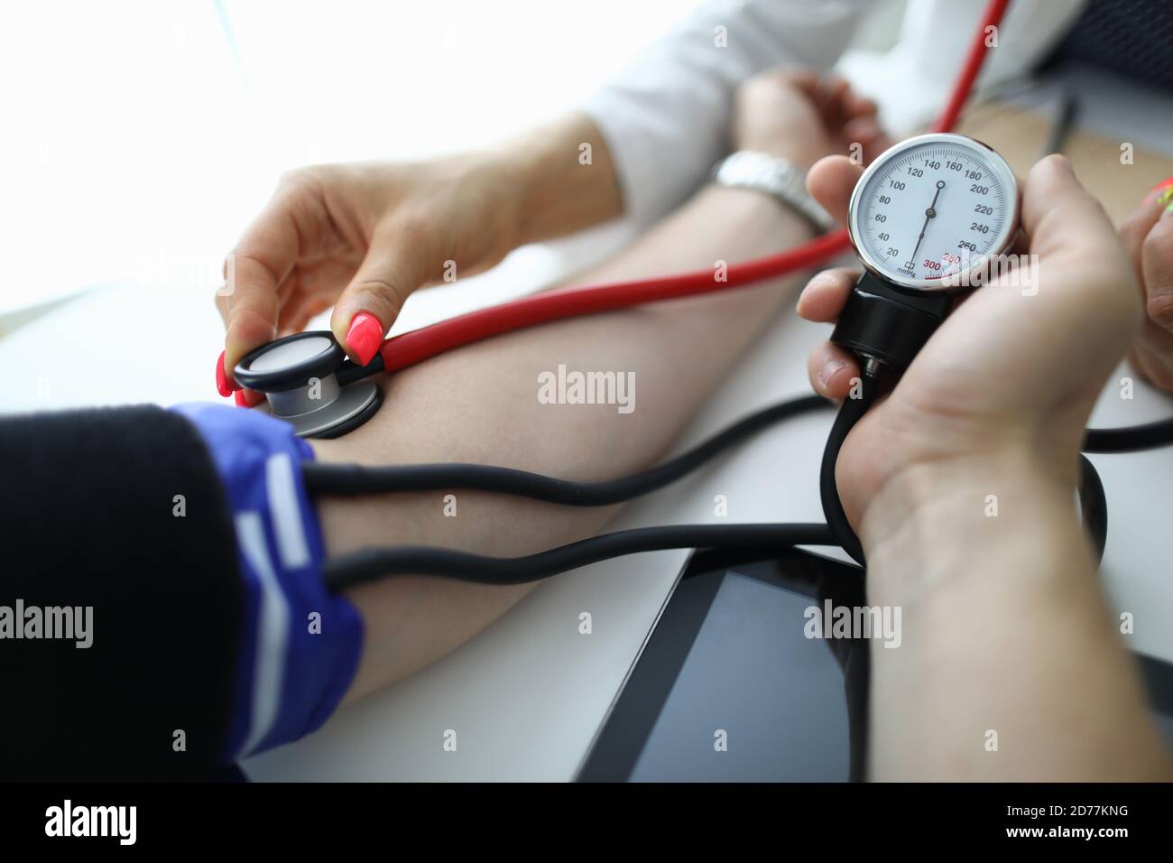 Measurement of pressure to patient by doctor closeup Stock Photo - Alamy