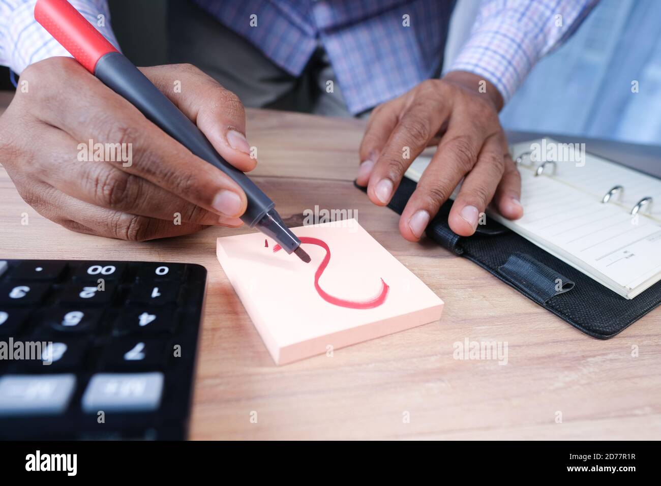 person hand drawing question mark on paper on office desk Stock Photo ...