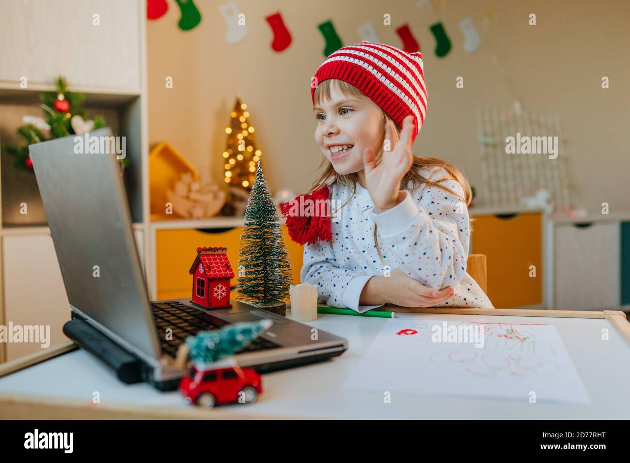 Little girl using laptop for video call Stock Photo - Alamy