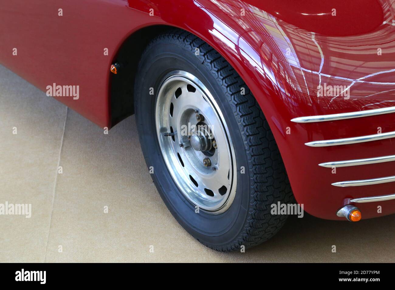 High angle shot of the front part of a red car Stock Photo - Alamy