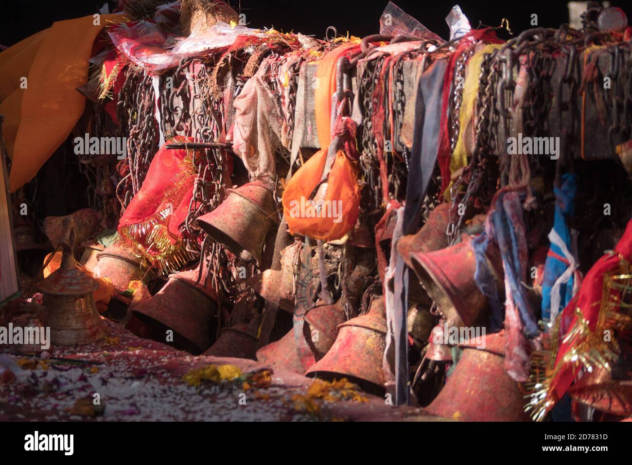 Nepal. Hindu bells at door of temple tinted in orange tika. Annapurna ...