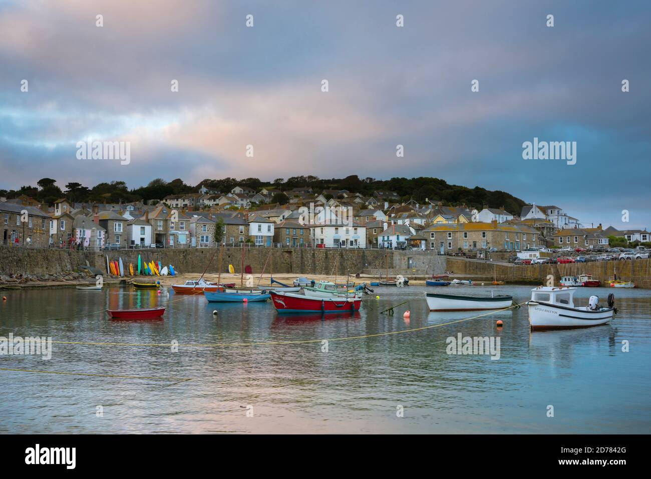 Mousehole Cornwall harbour, view at dusk of fishing boats moored in ...