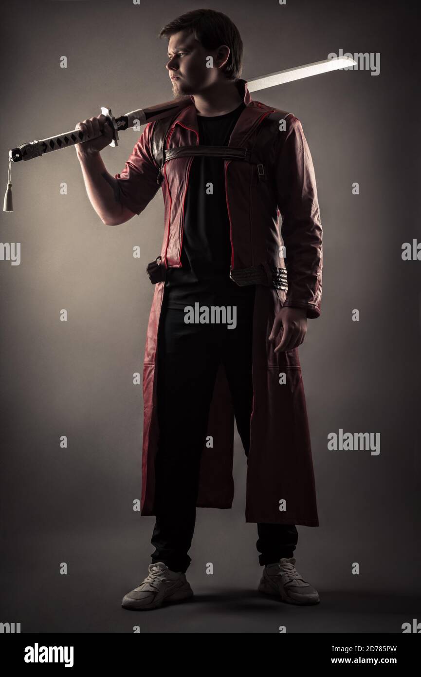 man with sword in cloak standing in full length Stock Photo - Alamy
