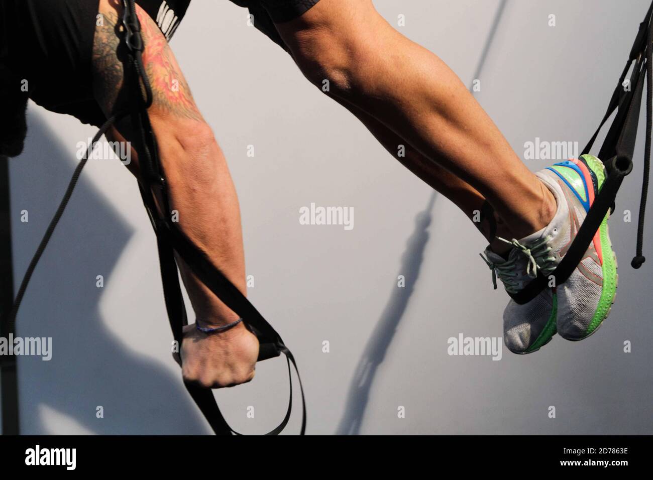 a male hand holding trx strap Stock Photo - Alamy