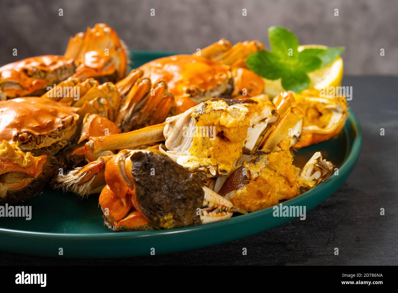 side view crabs with one opened showing the crab roe and meat ...