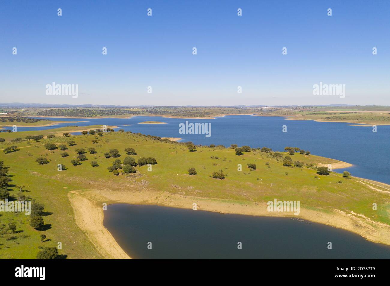 Dam lake reservoir drone aerial view of Barragem do Caia Dam olive ...