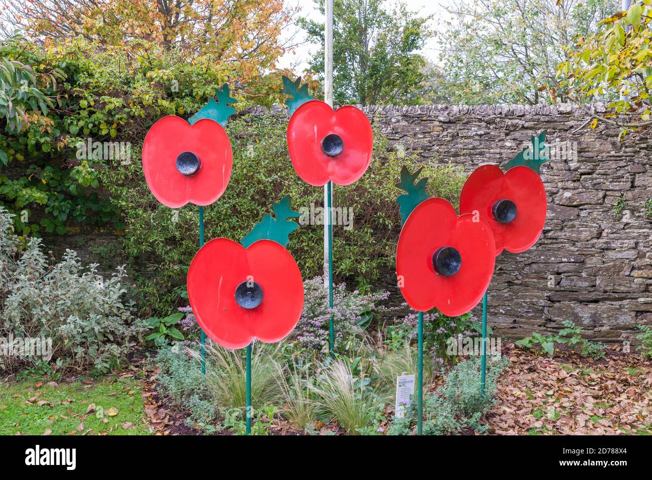 Display of large remembrance poppies in a flower bed in Kingsbridge ...