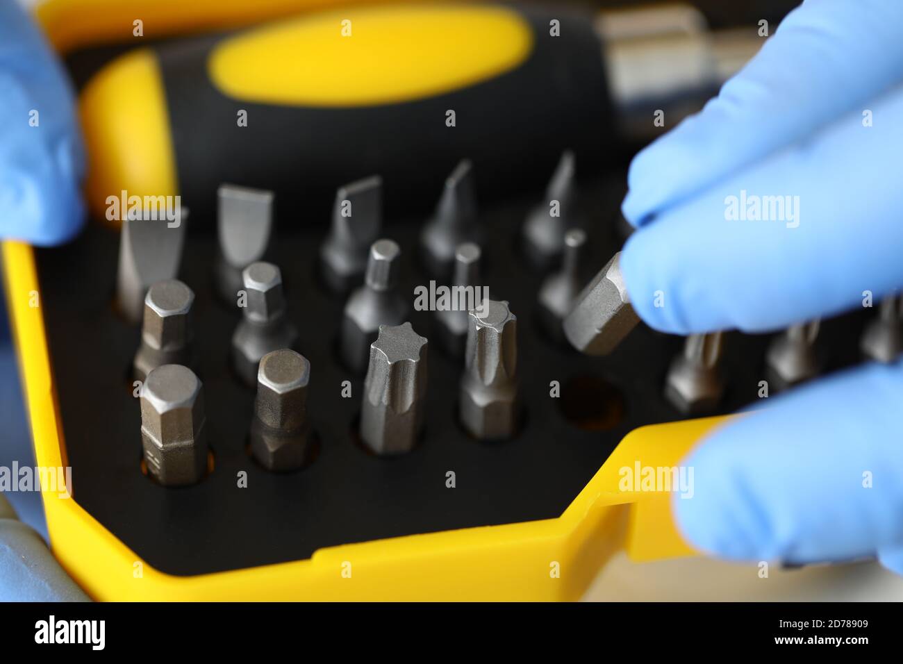 Yellow set with heads for screwdrivers and screwdriver Stock Photo - Alamy