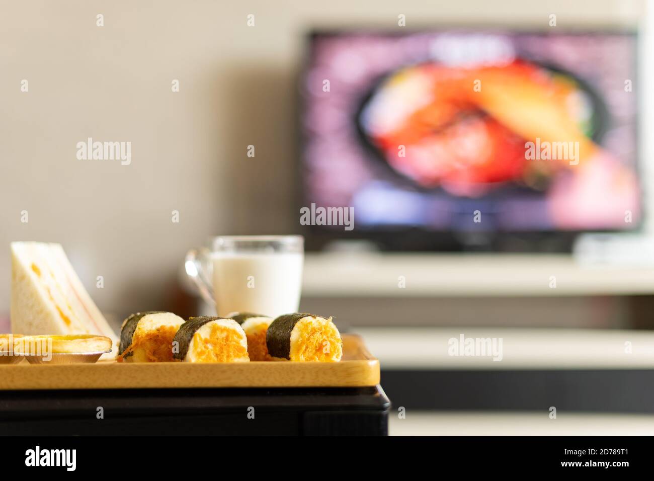 healthy breakfast in a living room with a TV broadcasting a food making ...