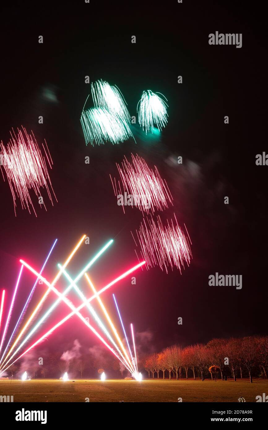 Spectacular and colourful firework display set against a dark Autumn ...