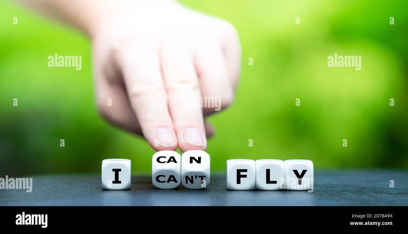 Hand turns dice and changes the expression "I can't fly" to "I can fly ...