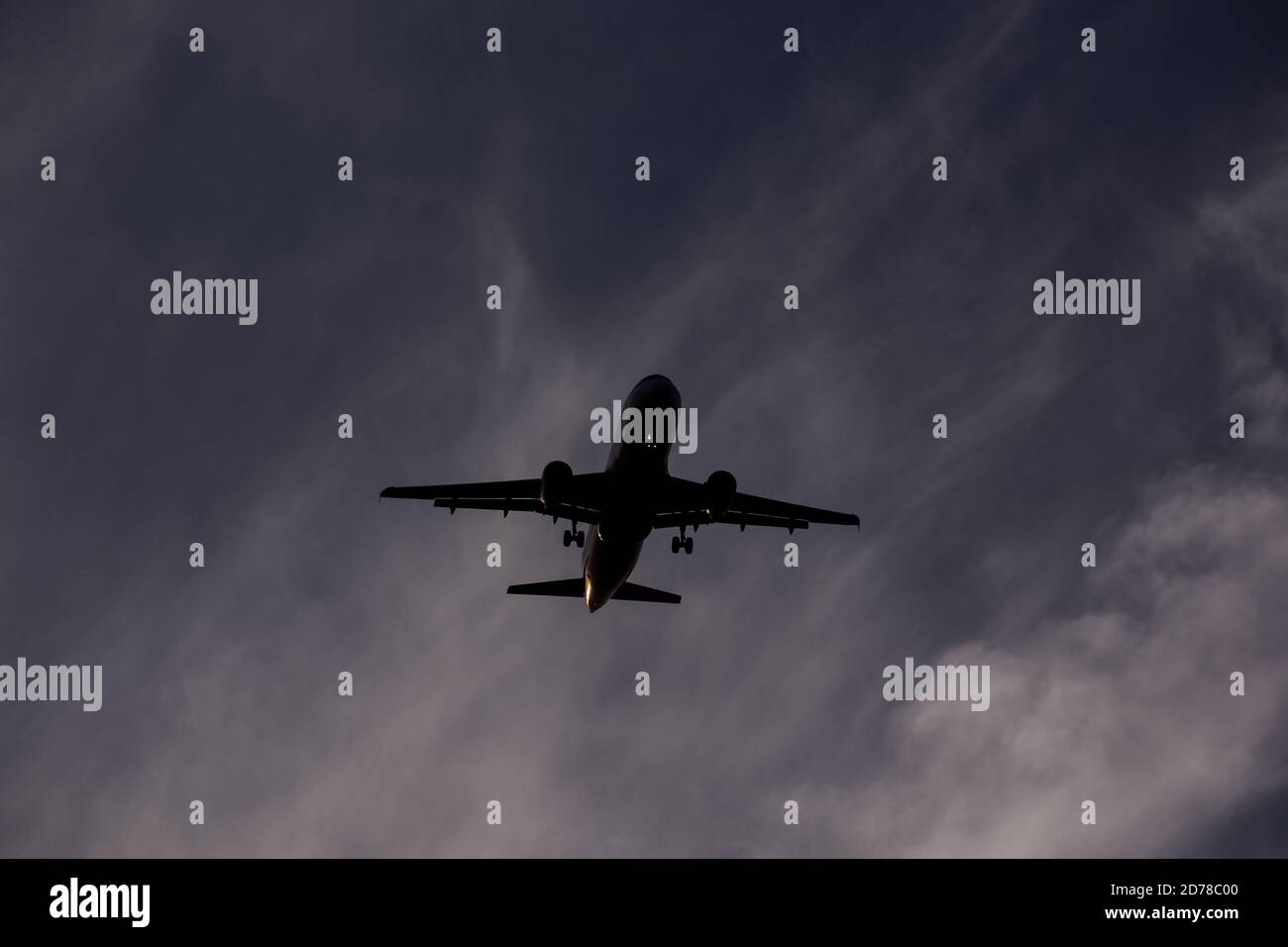 Silhouette airplane flying Stock Photo - Alamy