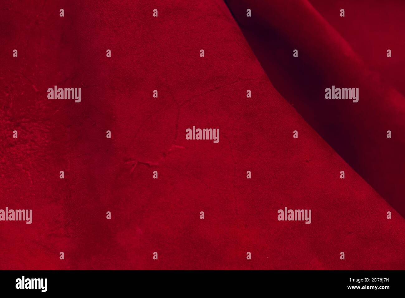 Red matte background of suede fabric, closeup. Velvet texture of ...