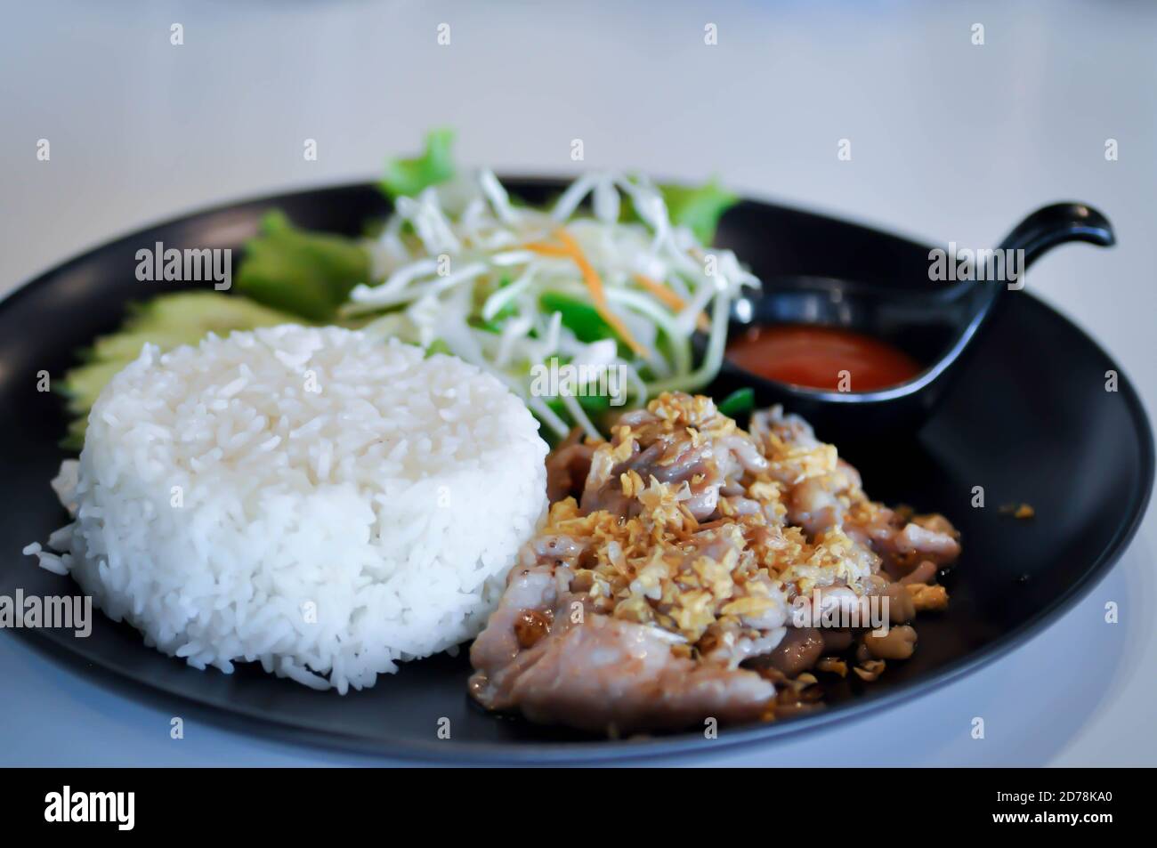 stir fried pork with garlic and rice ,pork and rice Stock Photo - Alamy
