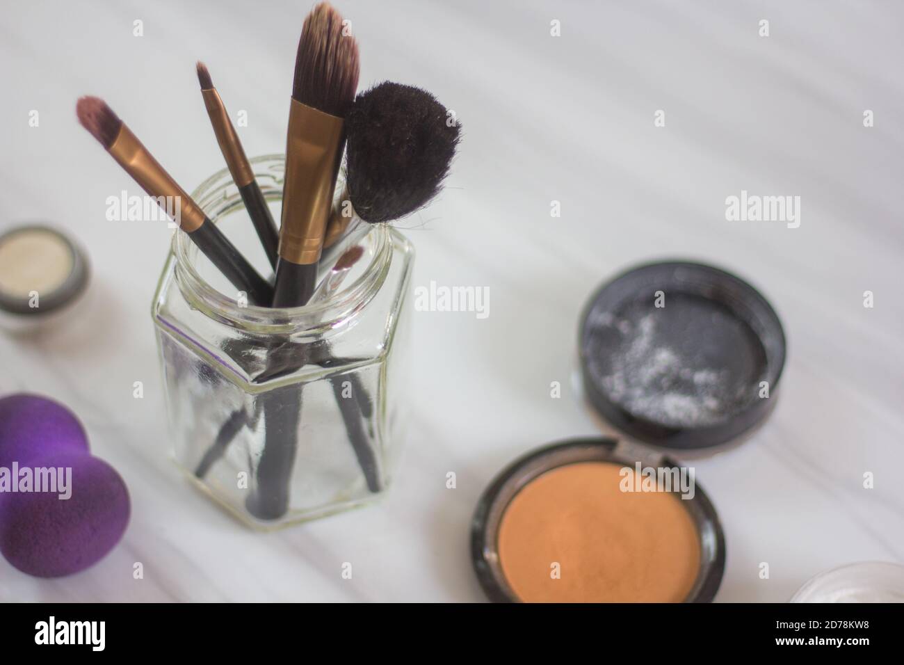 Make up elements on a table Stock Photo - Alamy