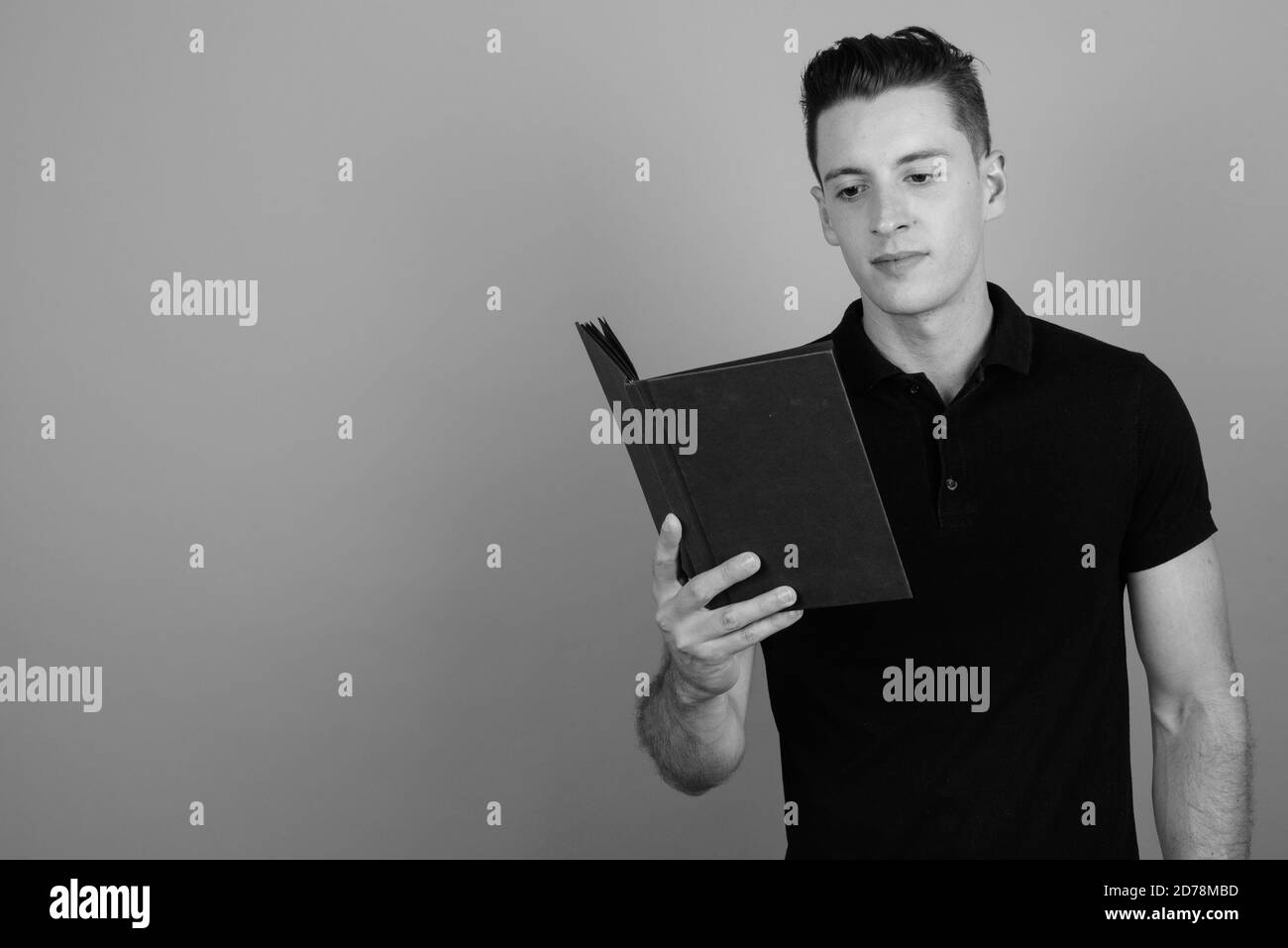 Adult male reading book hi-res stock photography and images - Alamy