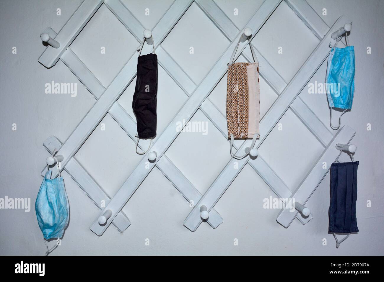 White hallway cloakroom with many hanging respiratory masks Stock Photo ...